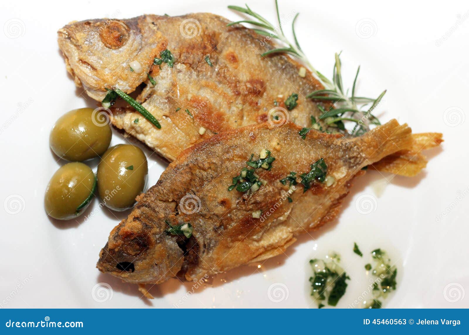 Two baked fish on a plate stock image. Image of delicious - 45460563
