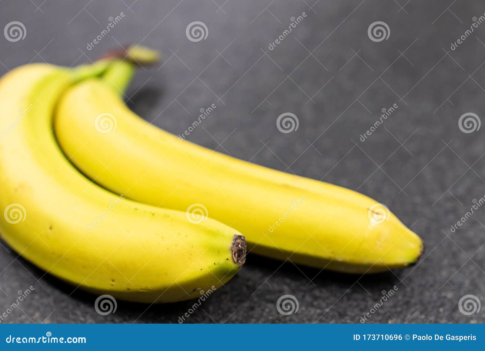 Two Bananas Joined Together on a Black Plane. Exotic Fruit, Yellow ...