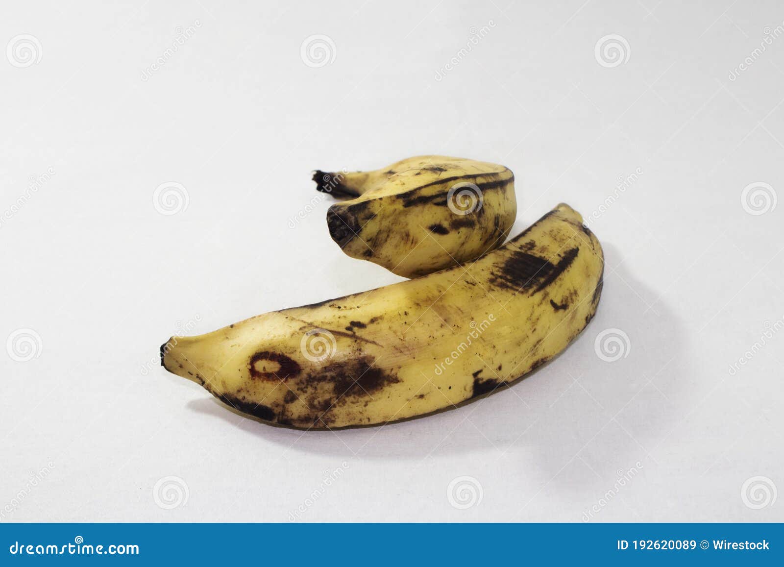 Two Bananas with Some Black Marks Isolated on the White Background ...