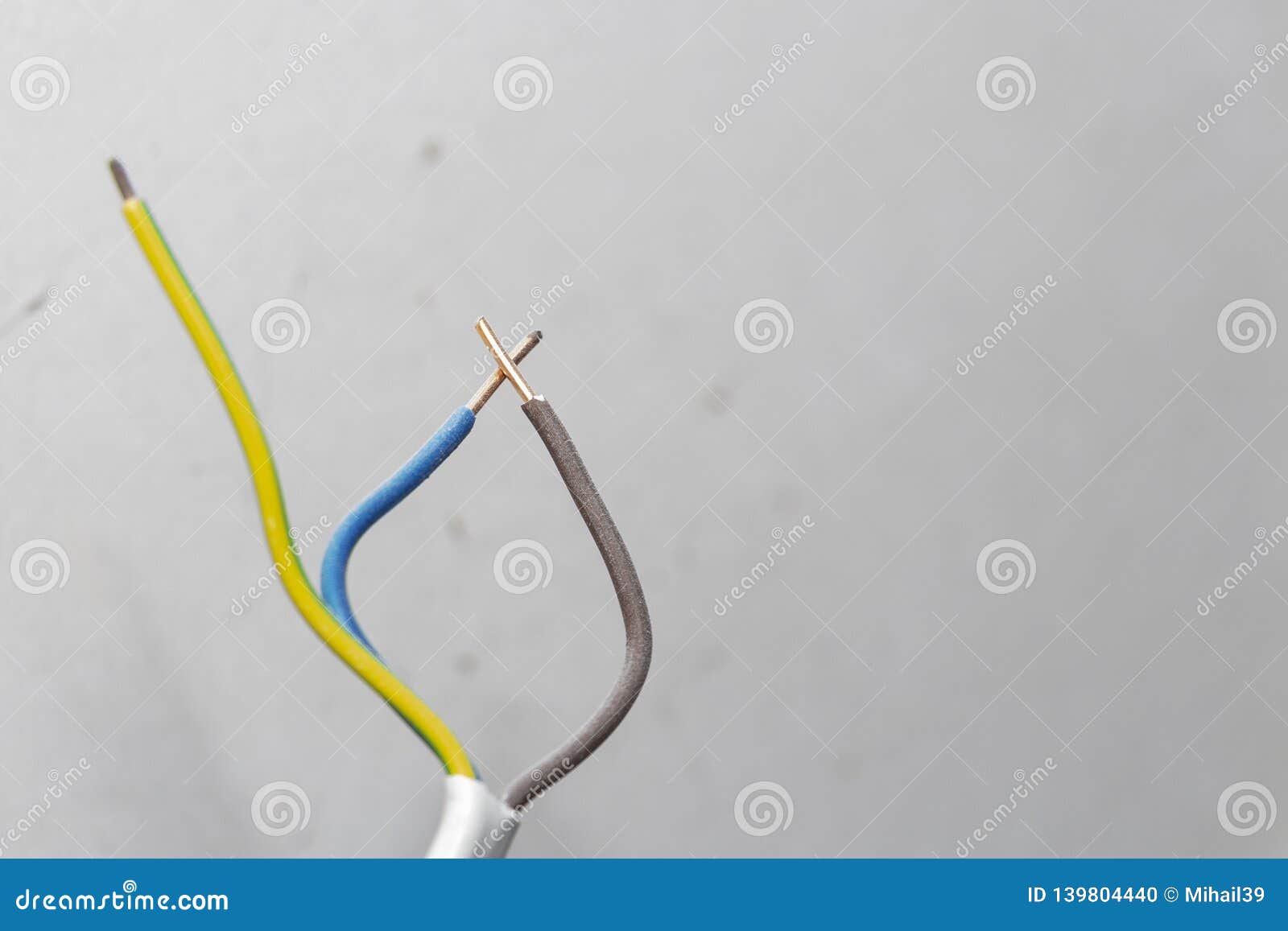 Two Bare Electrical Wires, On A Gray Background. Stock Photo ...