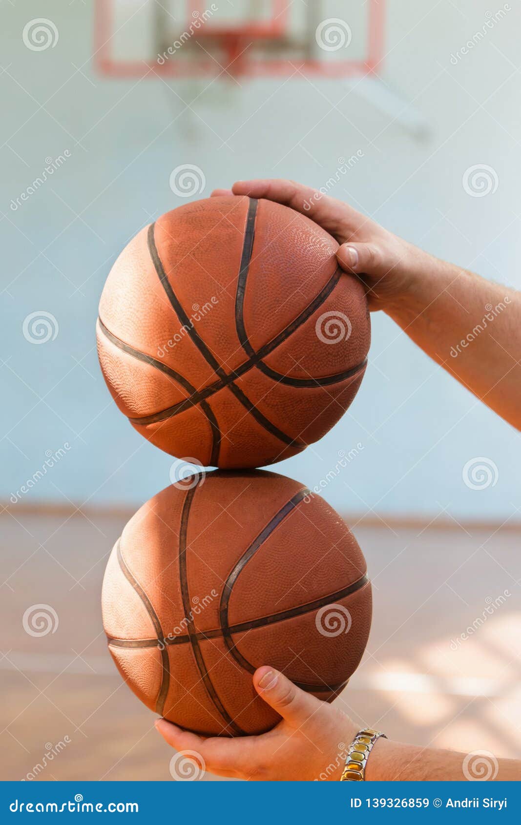 Two Basketballs in Male Hands Stock Image - Image of basket ...