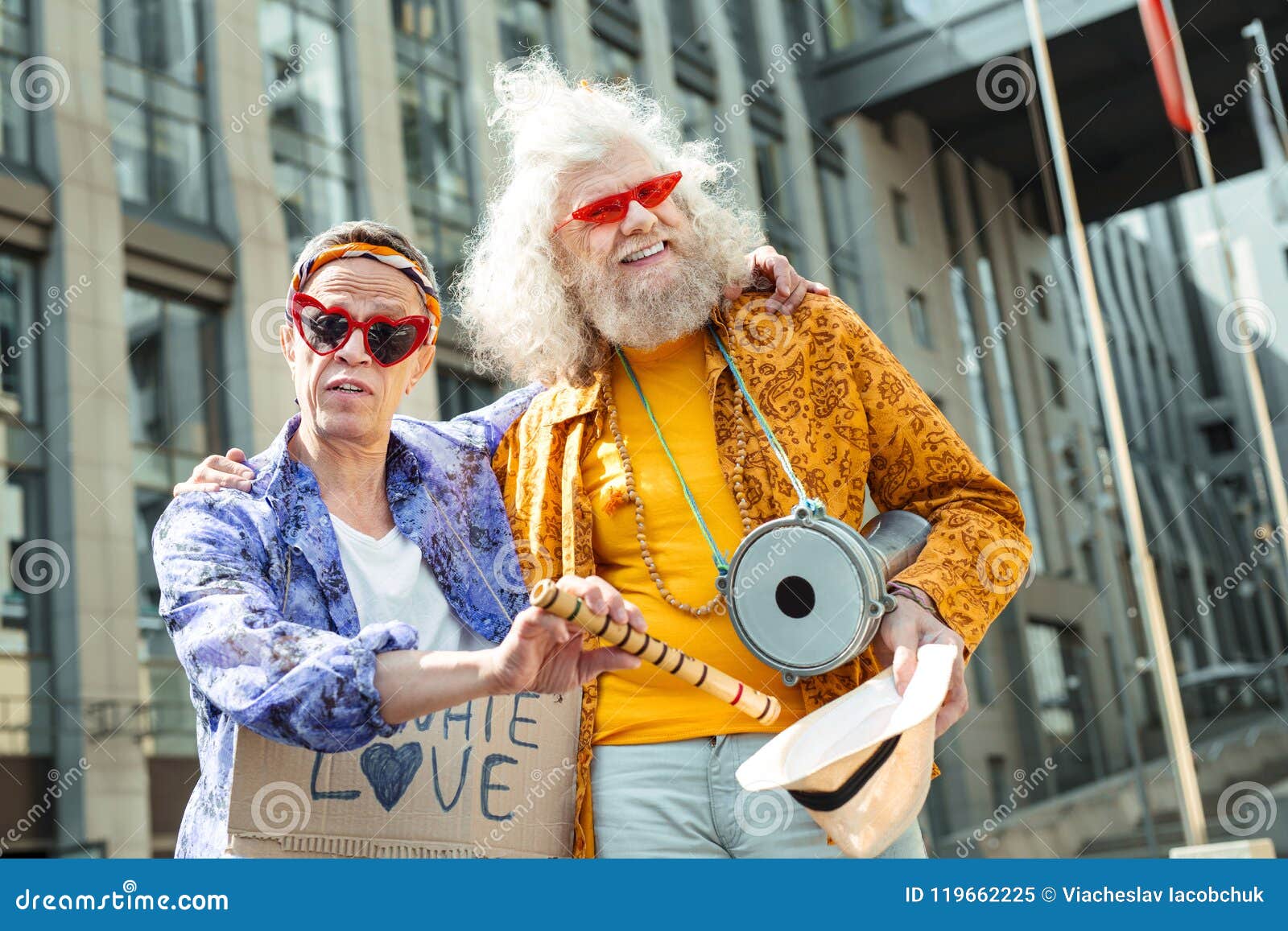 Two Beaming Hippies Playing the Harmonica Together Stock Image - Image ...