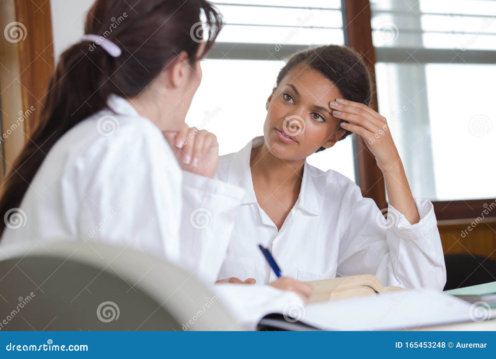 Two Beautiful Female Doctors Talking Stock Photo - Image of oncologist ...