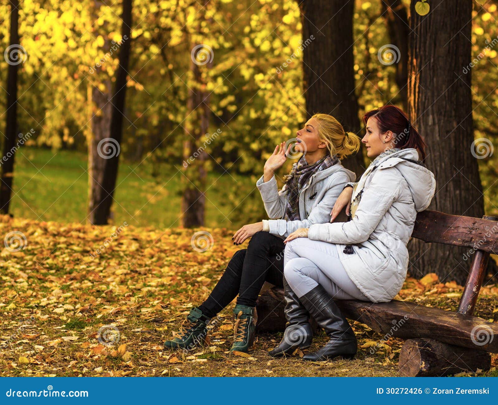 Two Beautiful Female Friends Resting on Bench in Park Stock Photo ...
