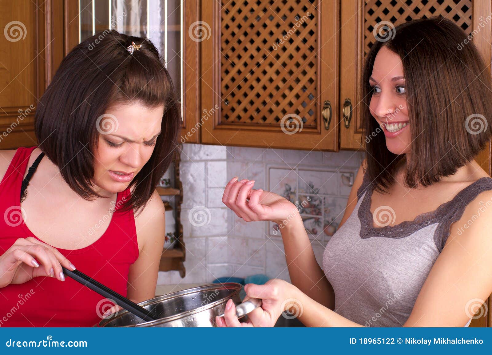 Two Beautiful Female Trying To Cook Stock Photo - Image of food ...