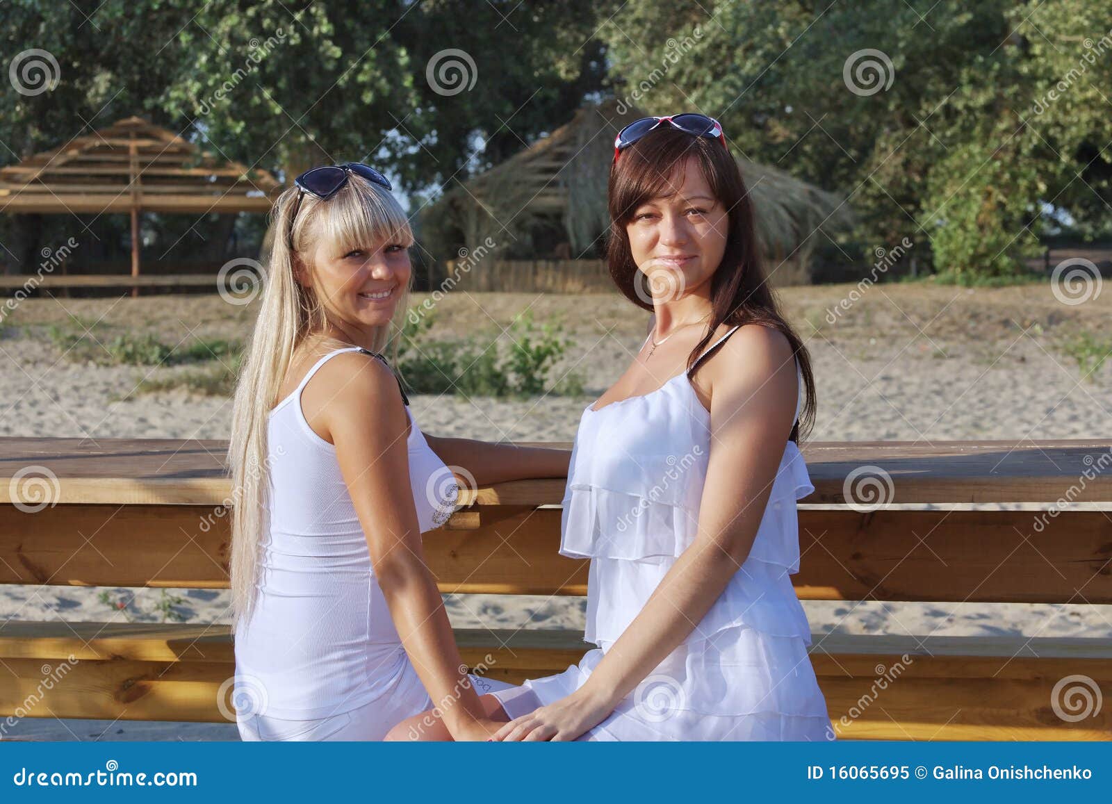 Two Beautiful Girls on a Bench Stock Image - Image of walk, women: 16065695