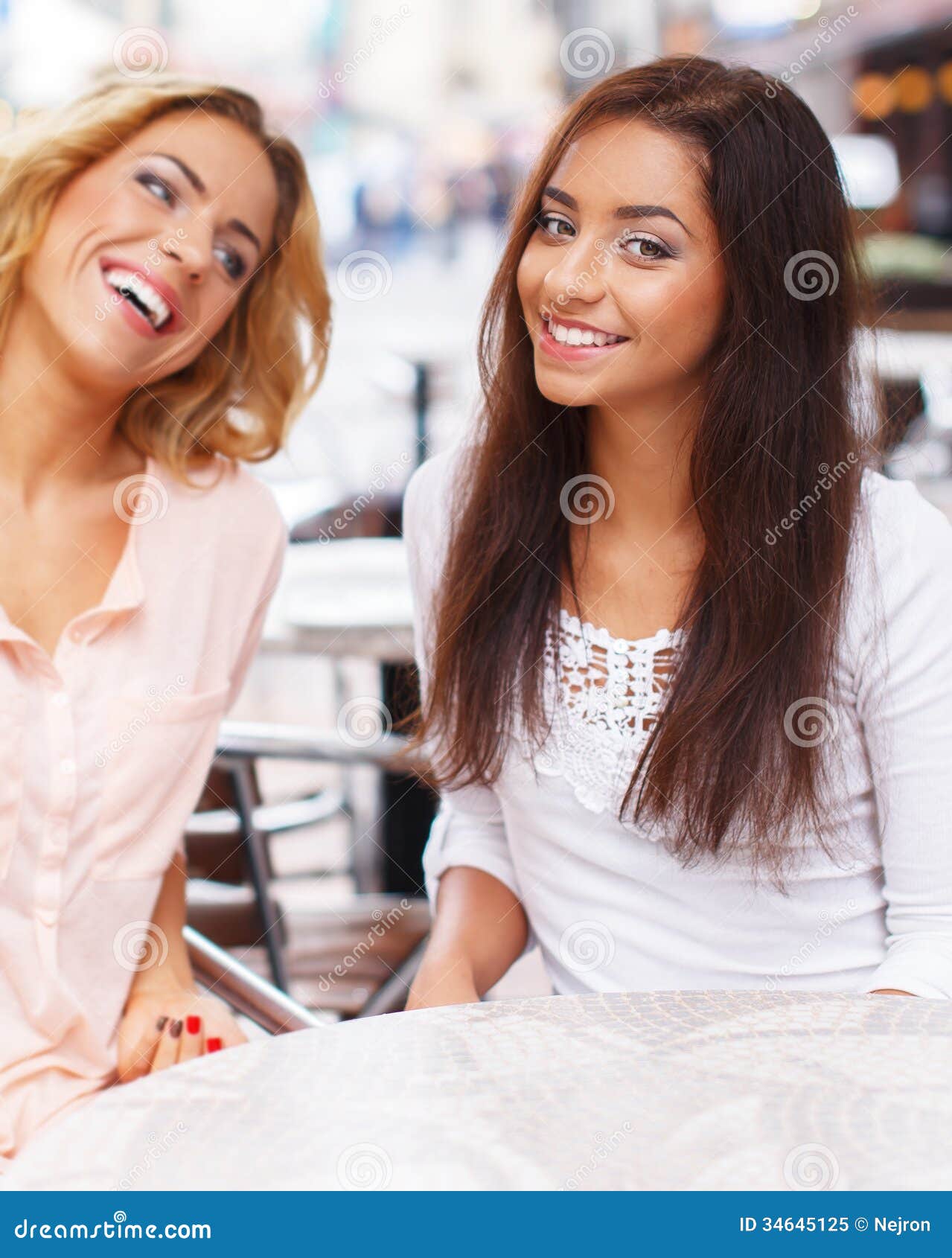 Two Beautiful Girls in Cafe Stock Image - Image of fashion, adult: 34645125