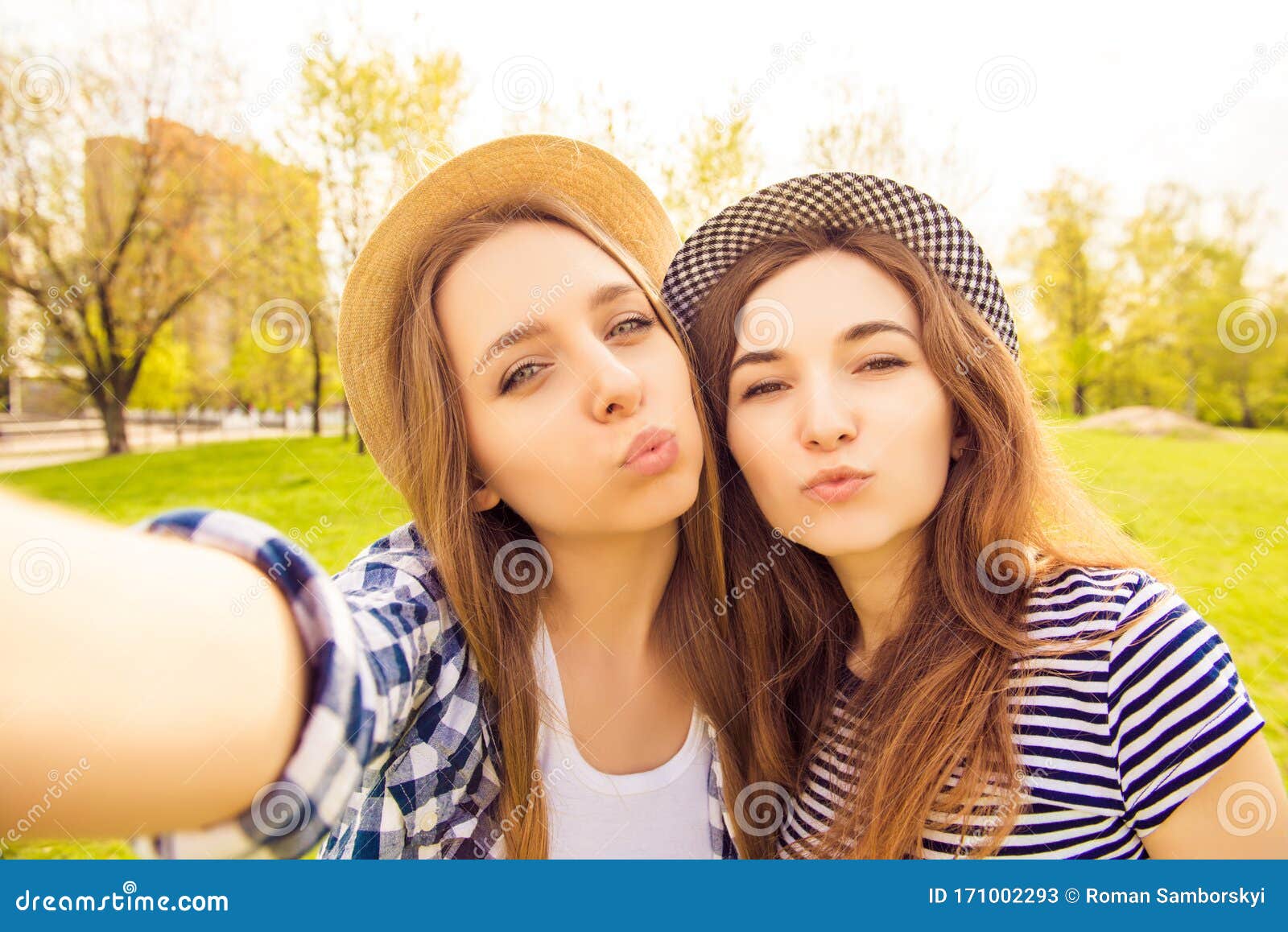Two Beautiful Girls in Caps Making Selfie and Pouting Stock Image ...