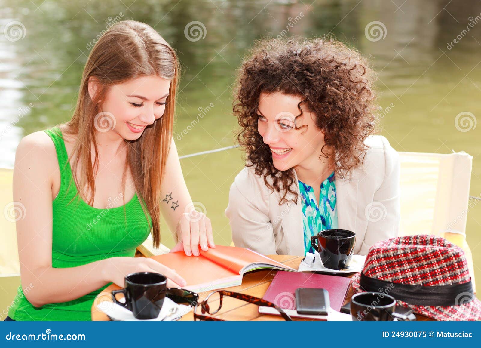 Two Beautiful Girls Chatting Over a Coffee Stock Image - Image of ...