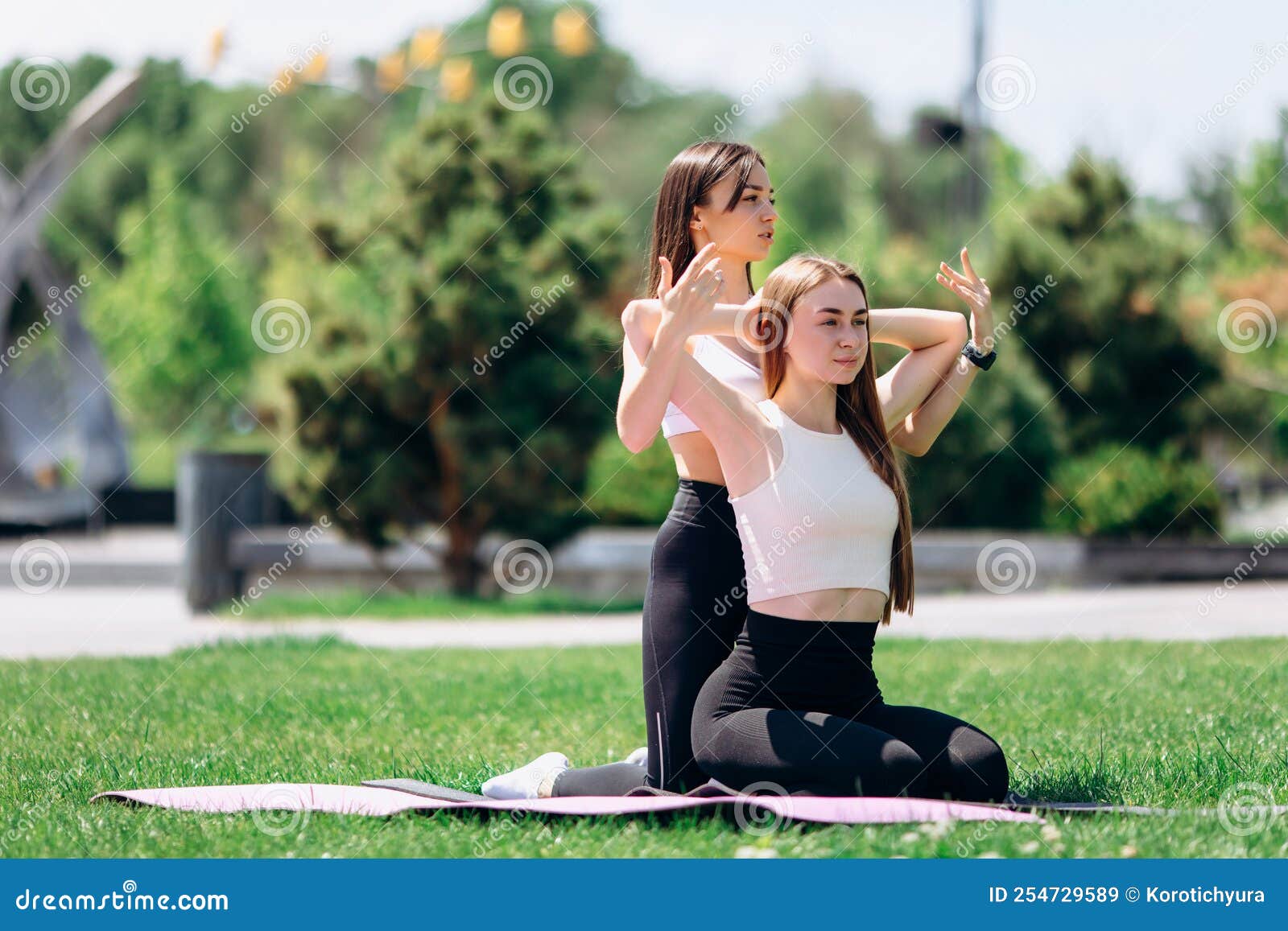 Two Beautiful Girls Do Exercises Outdoors in the Park Stock Image ...