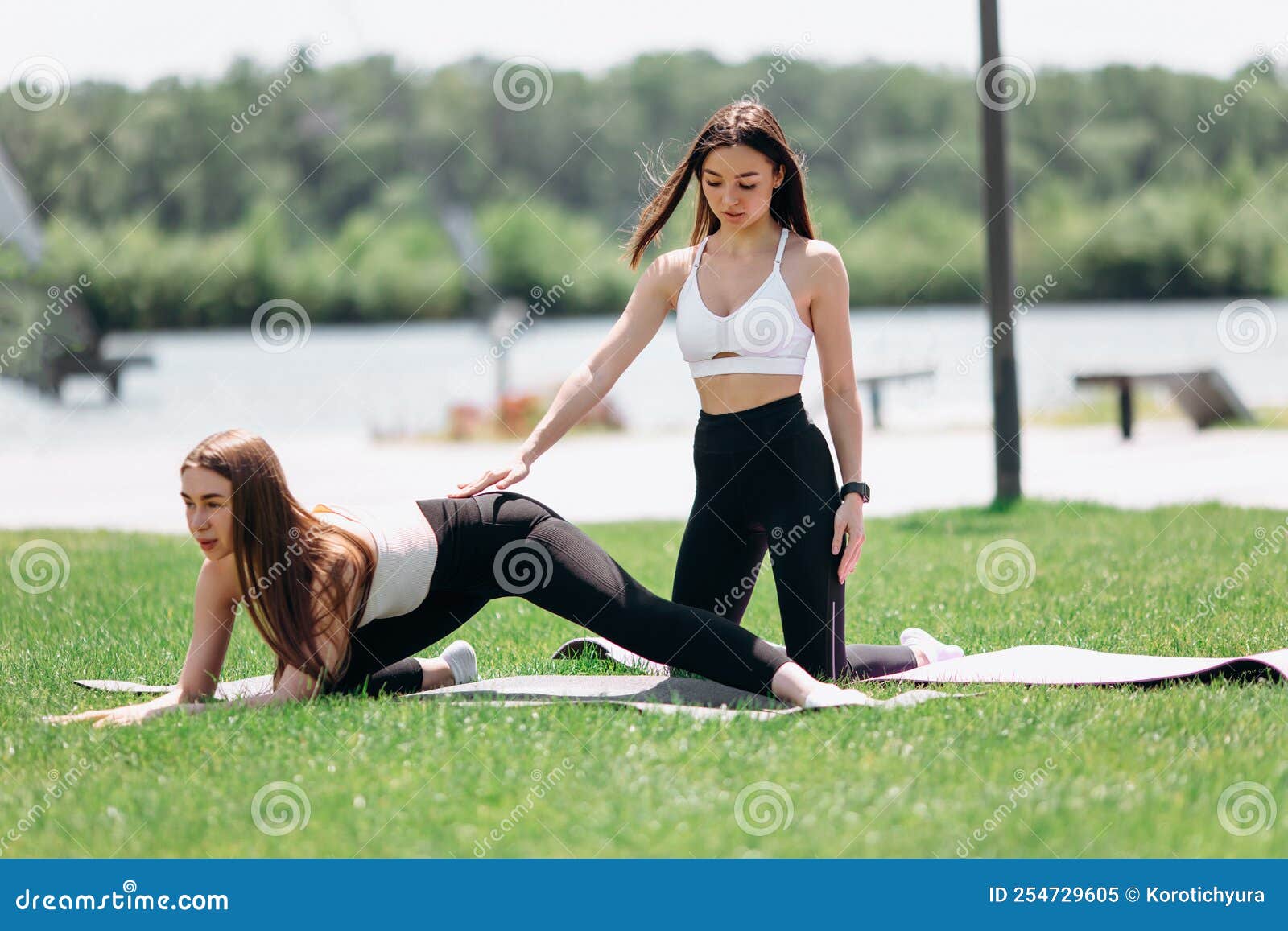 Two Beautiful Girls Do Exercises Outdoors in the Park Stock Image ...