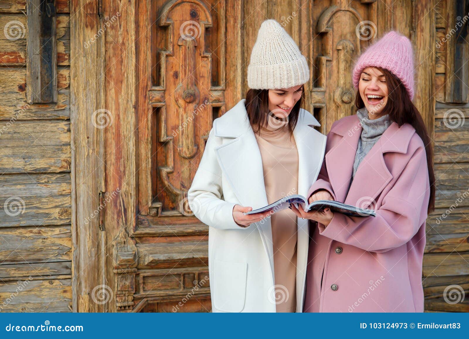 Two Beautiful Girls Read Magazine and Smile Outdoors Stock Image ...