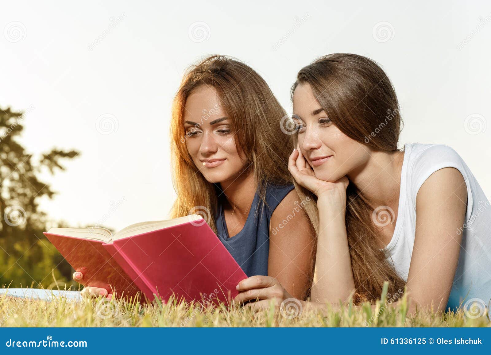 Two Beautiful Girls Reading Book in the Park Stock Image - Image of ...