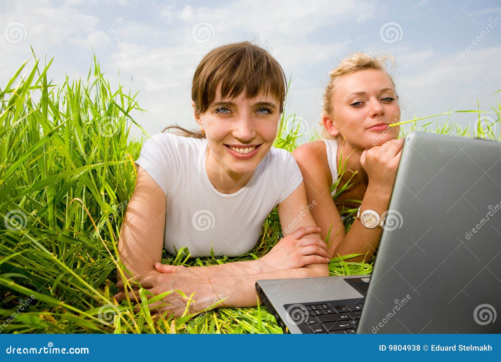Two Beautiful Girls in White Fun Working on Laptop Stock Photo - Image ...
