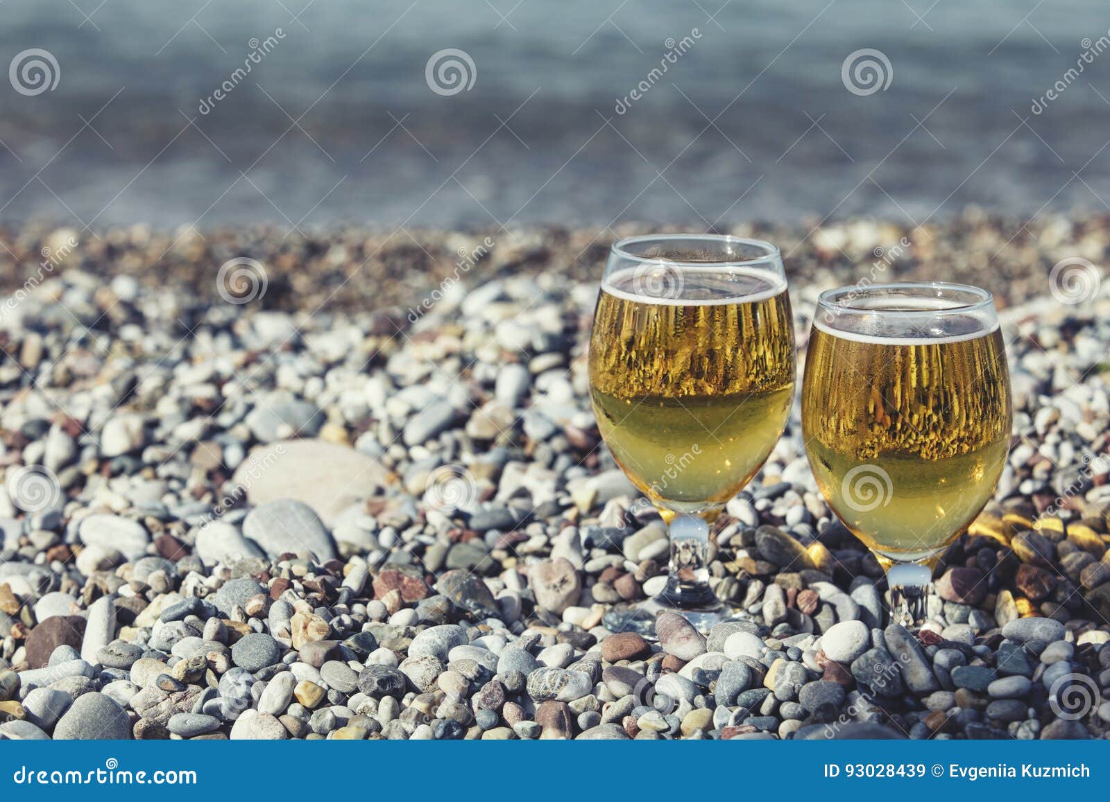 Two Beautiful Glass with Light Refreshments on the Pebbles on Th Stock ...