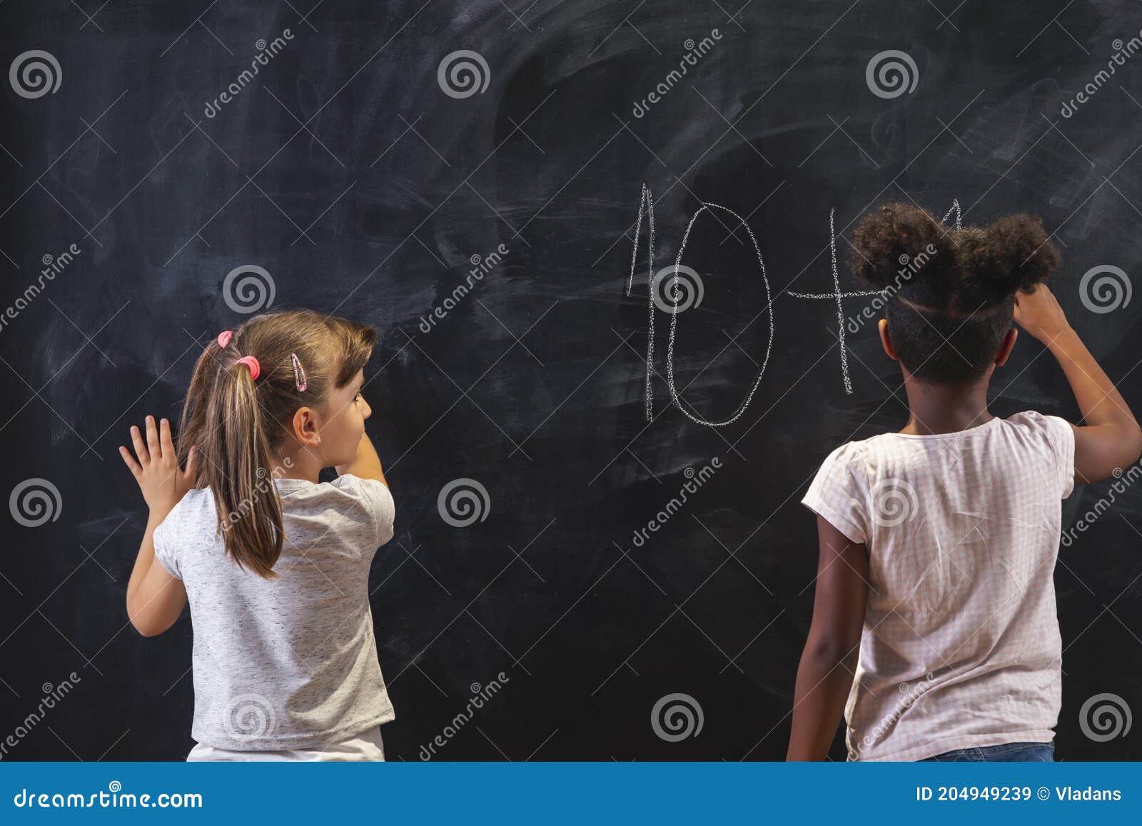 Two Schoolgirls Doing Math on Chalkboard in Classroom Stock Image ...