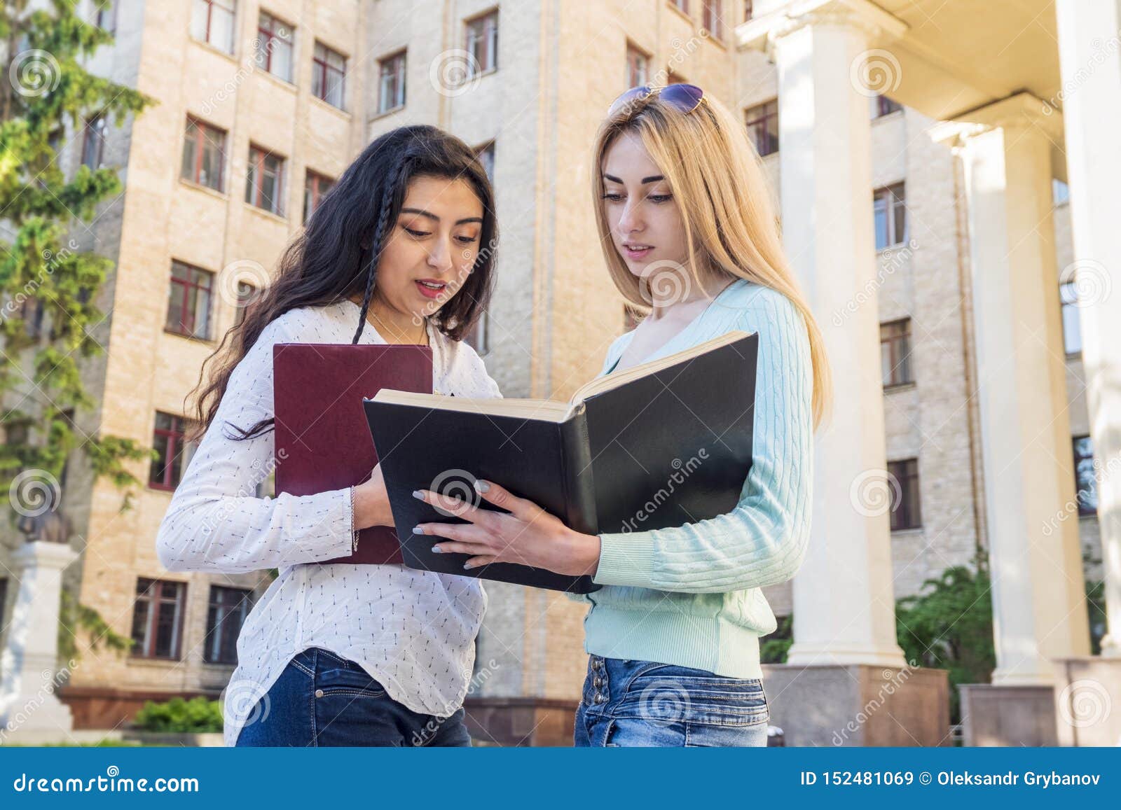 Two Female Students Study Textbook Stock Image - Image of education ...