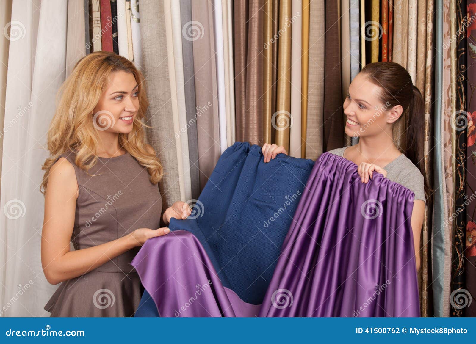 Two Beautiful Women Comparing Textile. Stock Photo - Image of ...