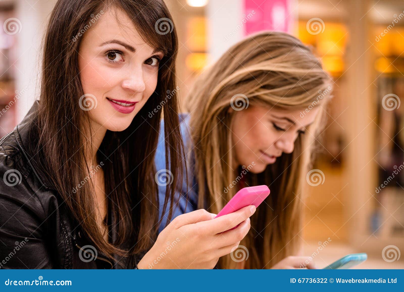 Two Beautiful Women Using Their Phone Stock Photo - Image of internet ...
