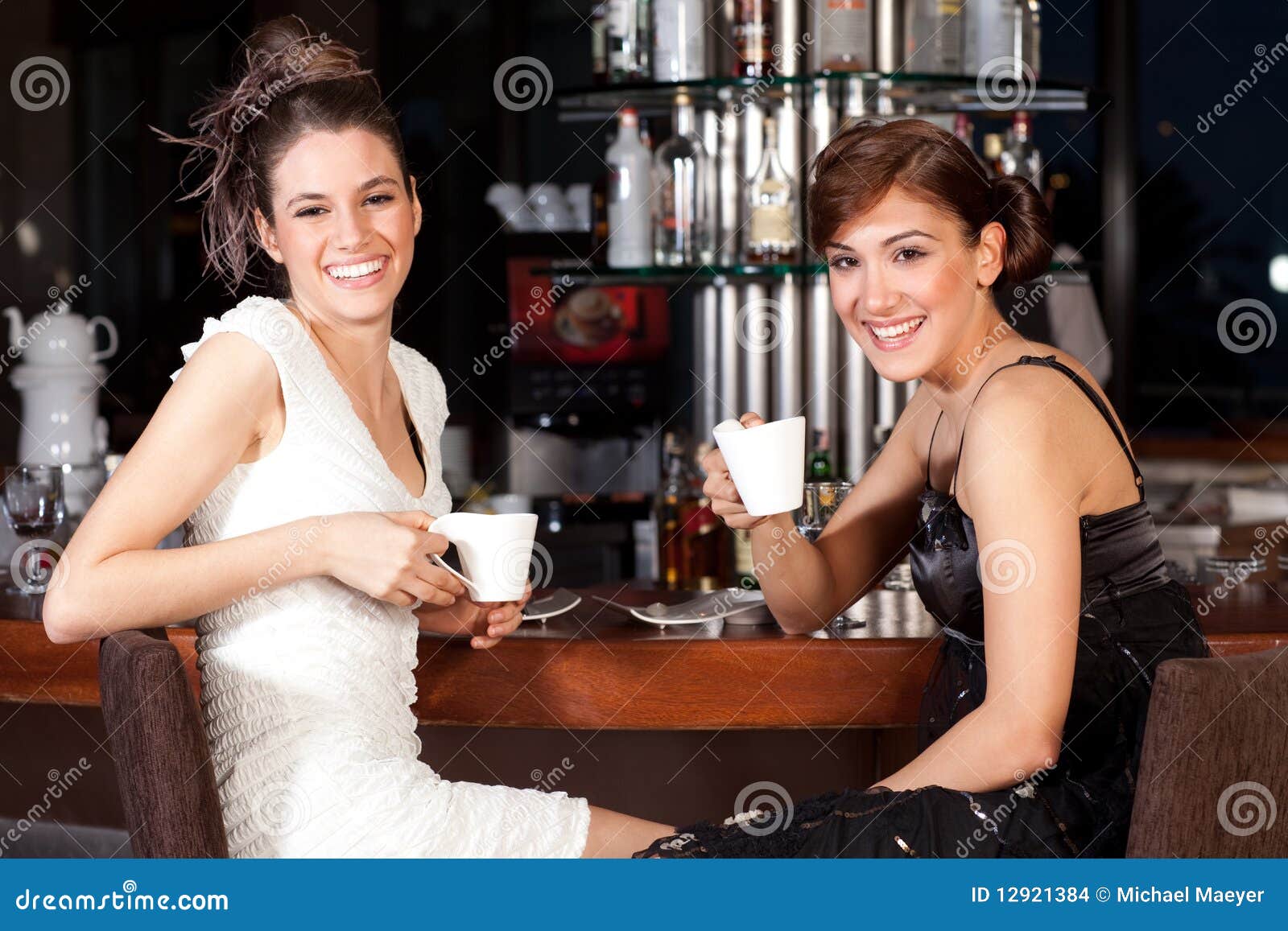 Two Beautiful Young Women Drinking Coffee At Bar Stock Images - Image ...
