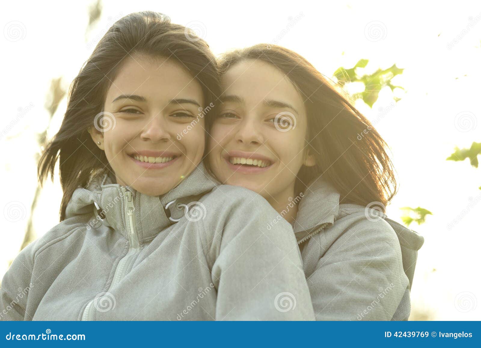Two Beautiful Young Women Hugging and Laughing Stock Image - Image of ...