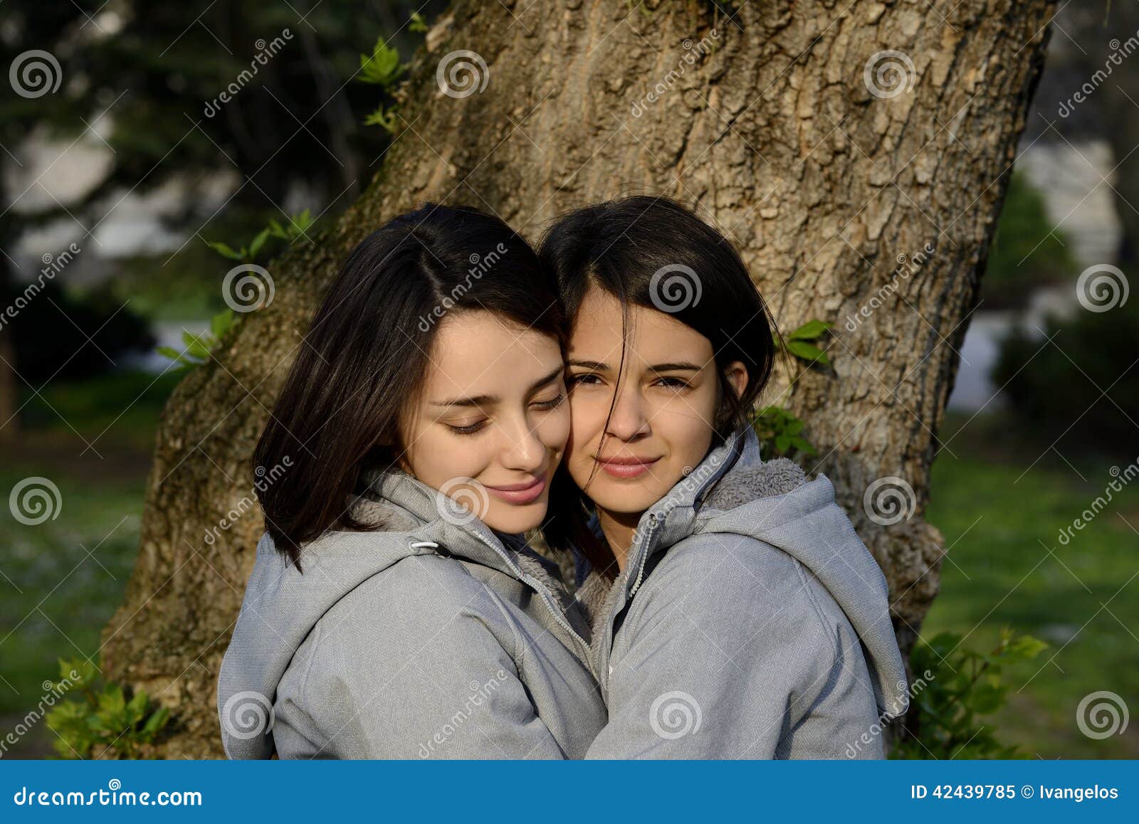 Two Beautiful Young Women Hugging Outside Stock Image - Image of hand ...