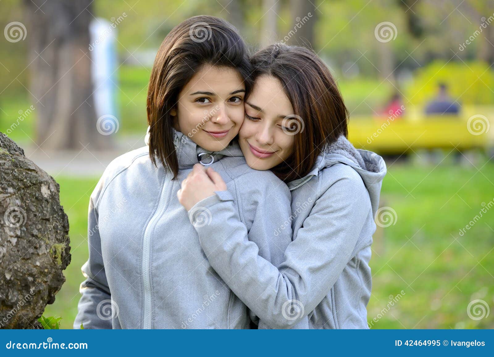Two Beautiful Young Women Hugging Outside Stock Image - Image of nature ...