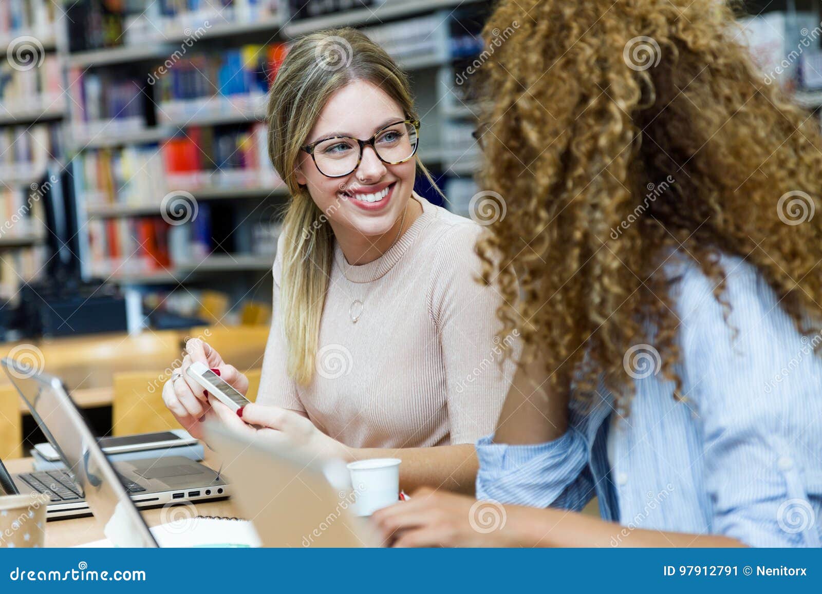 Two Beautiful Young Women Studying in a University Library. Stock Image ...
