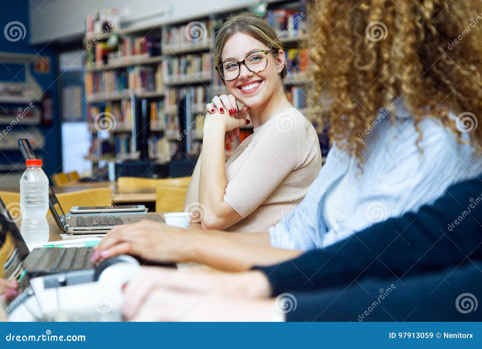 Two Beautiful Young Women Studying in a University Library. Stock Image ...