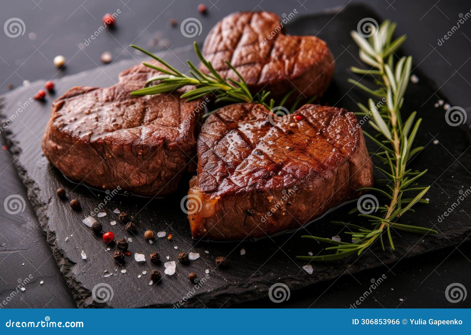 Two Beef Steaks with Hearts on Black Board Background Stock Photo ...