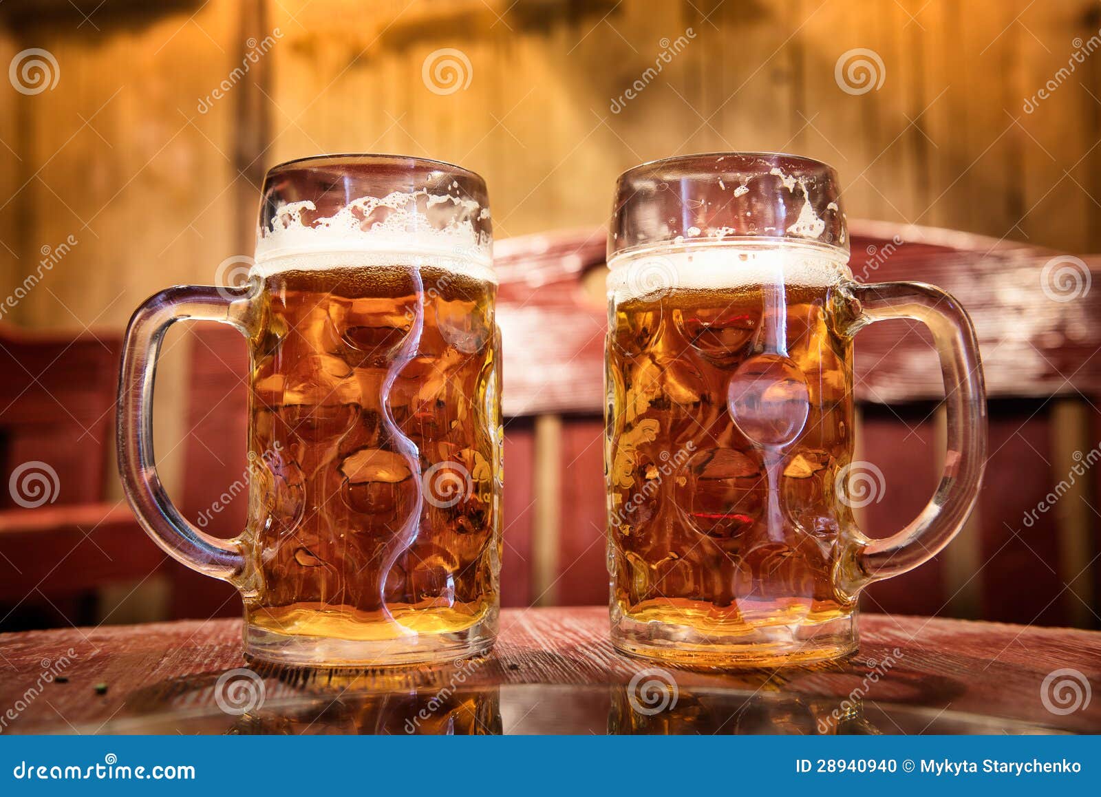 Two beer mugs at the bar stock photo. Image of flame - 28940940