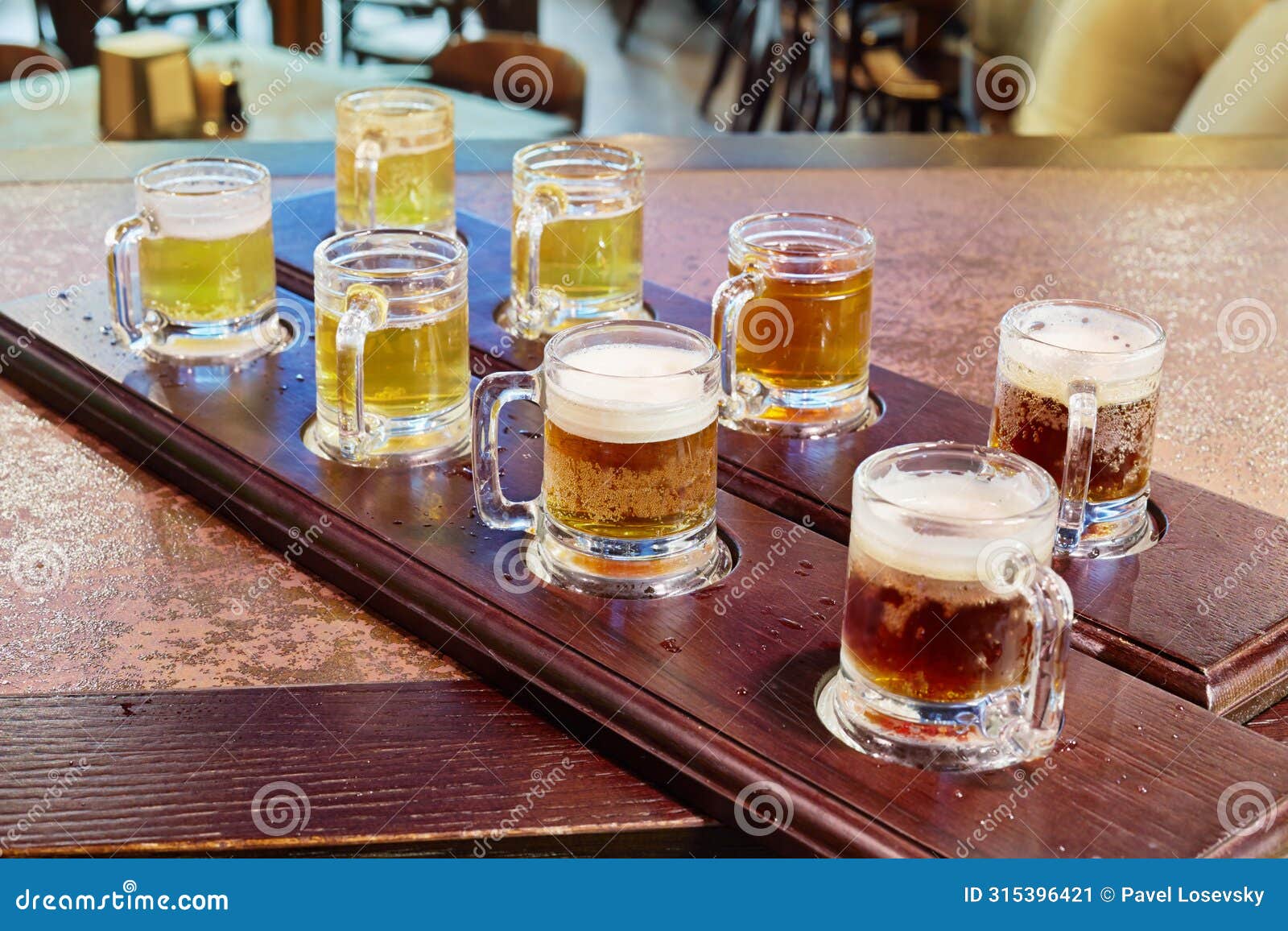 Two Beer Paddles with Mugs Full of Beer on Stock Image - Image of ...