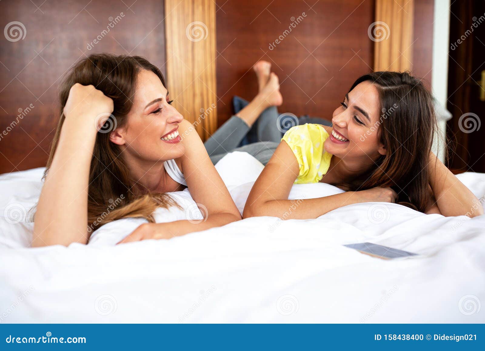 Two Best Friends Chilling on the Bed Stock Photo - Image of booking ...