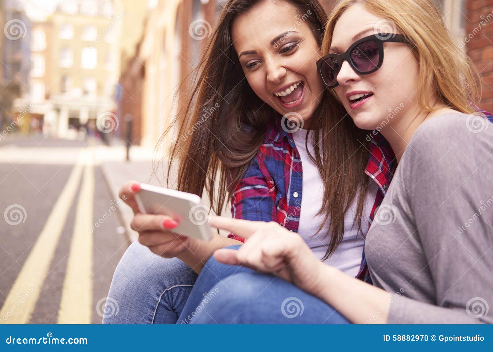 Two Best Friends with Mobile Phone Stock Photo - Image of eyewear ...