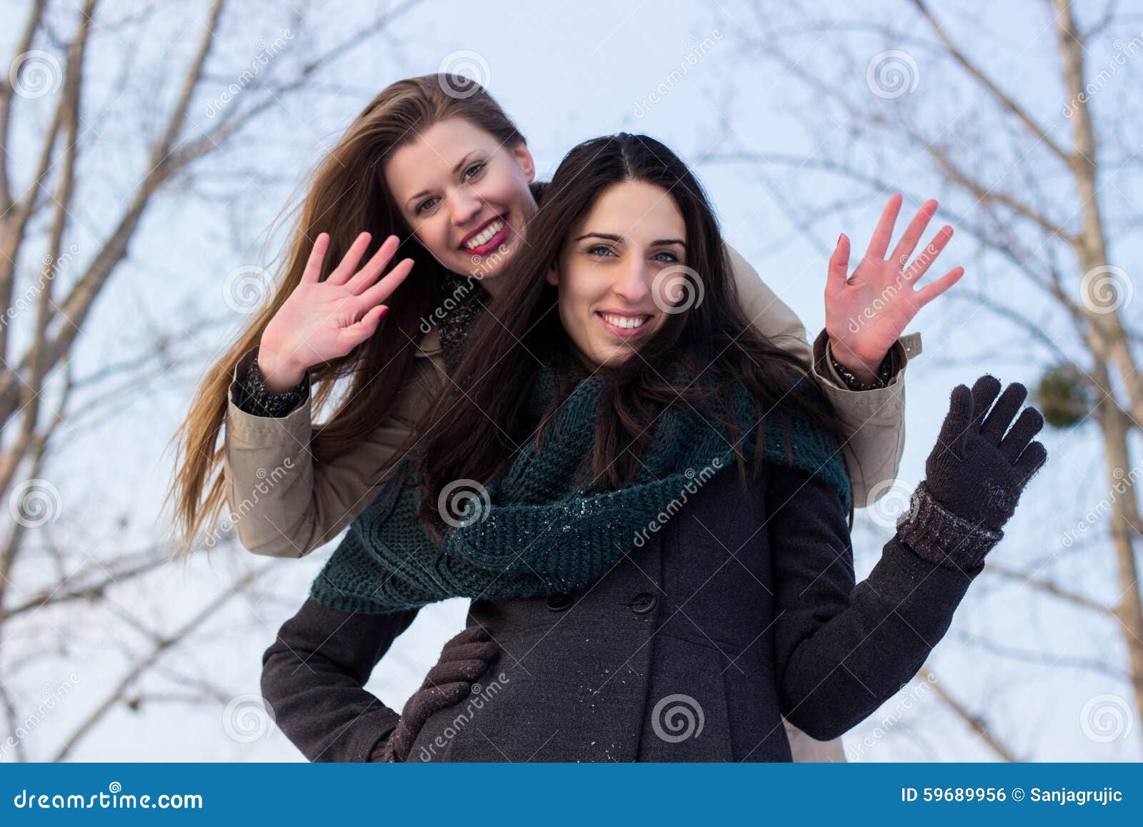 Two Best Friends Smiling and Waving Stock Photo - Image of outdoors ...