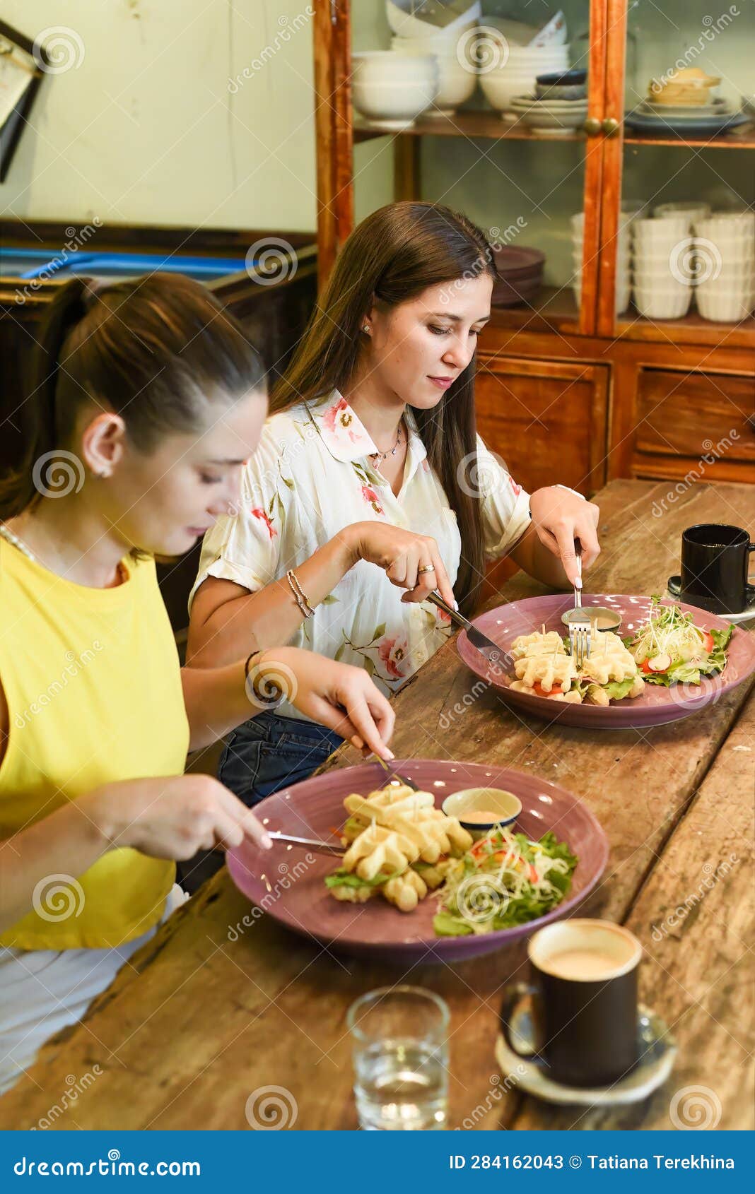 Two Best Friends Talking and Eating in a Cafe Stock Image - Image of ...