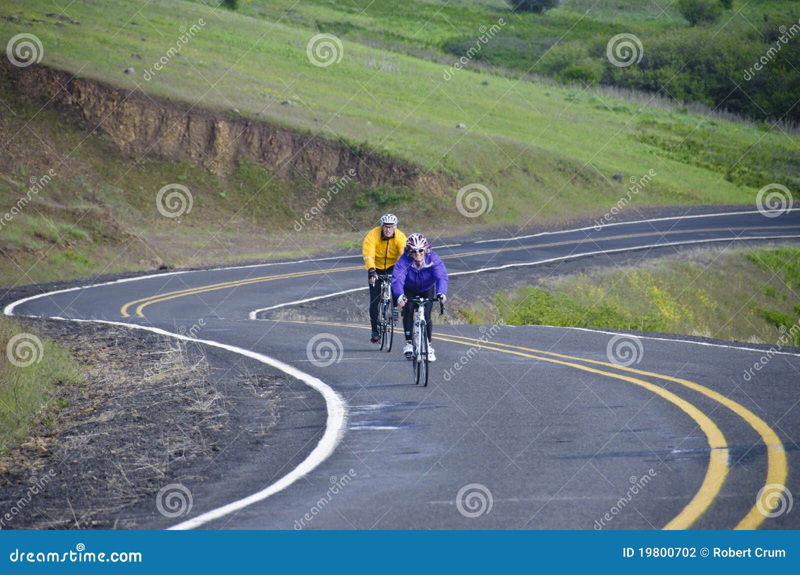Two Bicycle Riders on Rural Road Stock Photo - Image of bike, asphalt ...