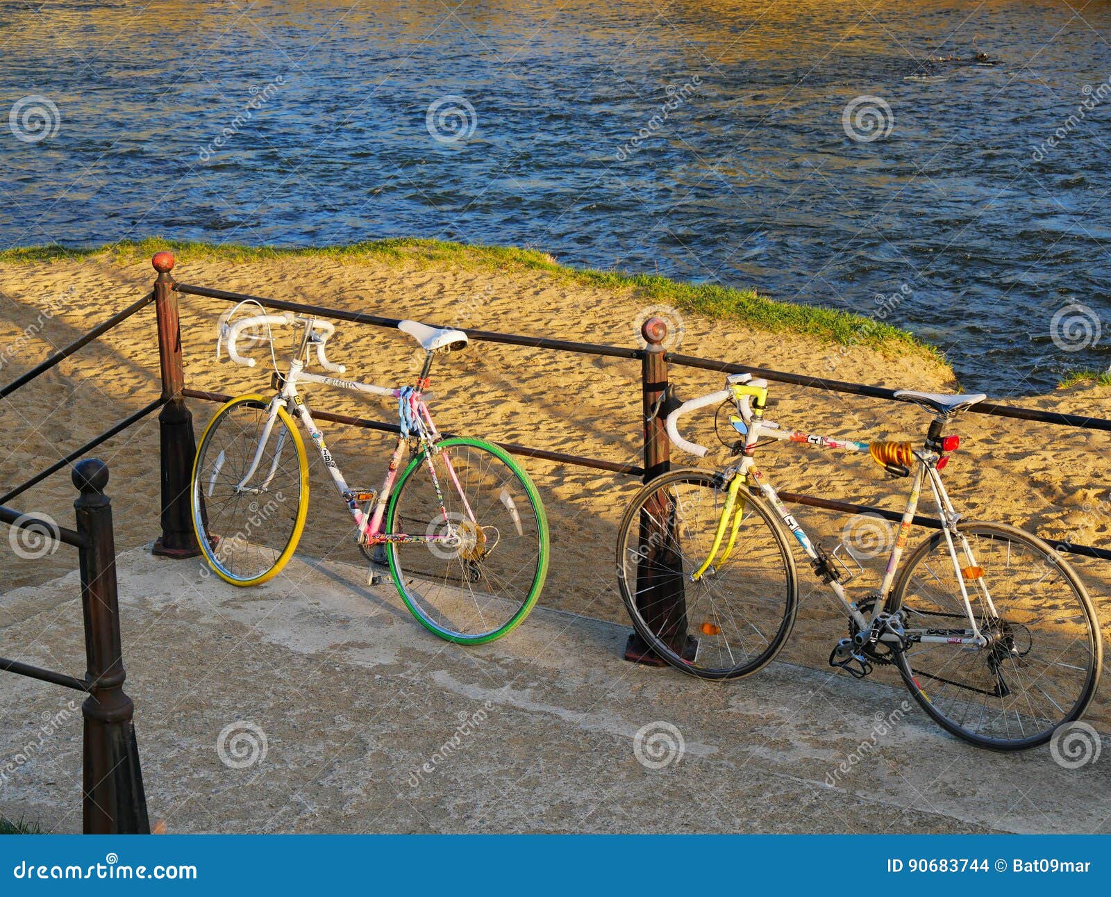 Two Bicycles Lean on a Railing by the River Editorial Stock Image ...