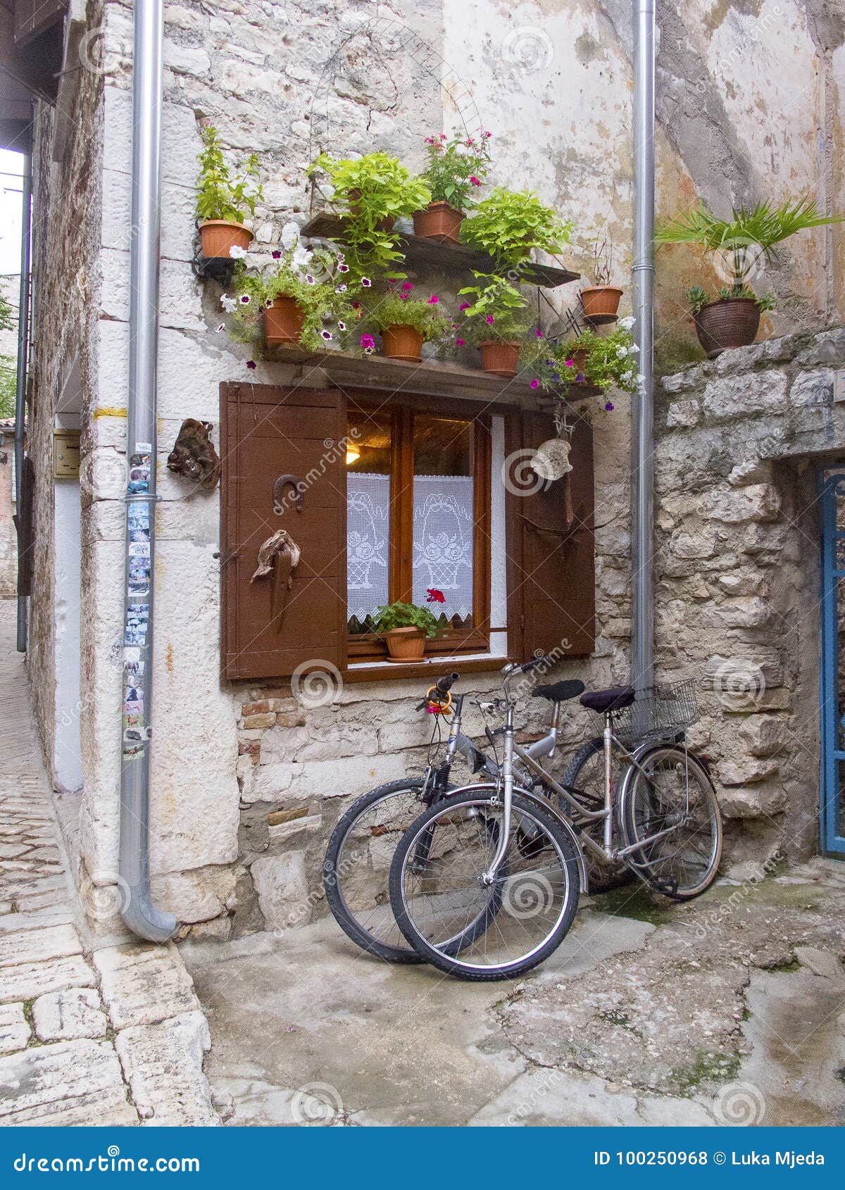 Two Bicycles Parked Under a Window in the Old Town Editorial Stock ...