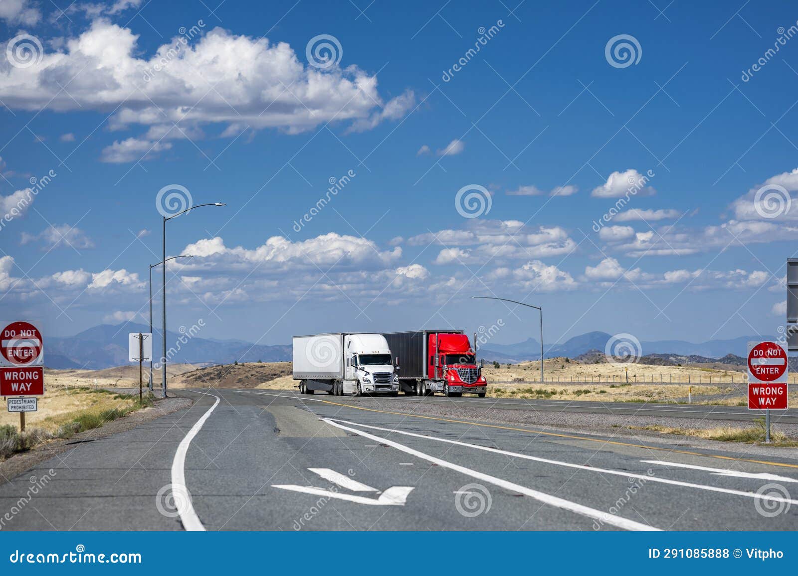 Two Big Rigs Semi Trucks with Semi Trailers Transporting Cargo Driving ...
