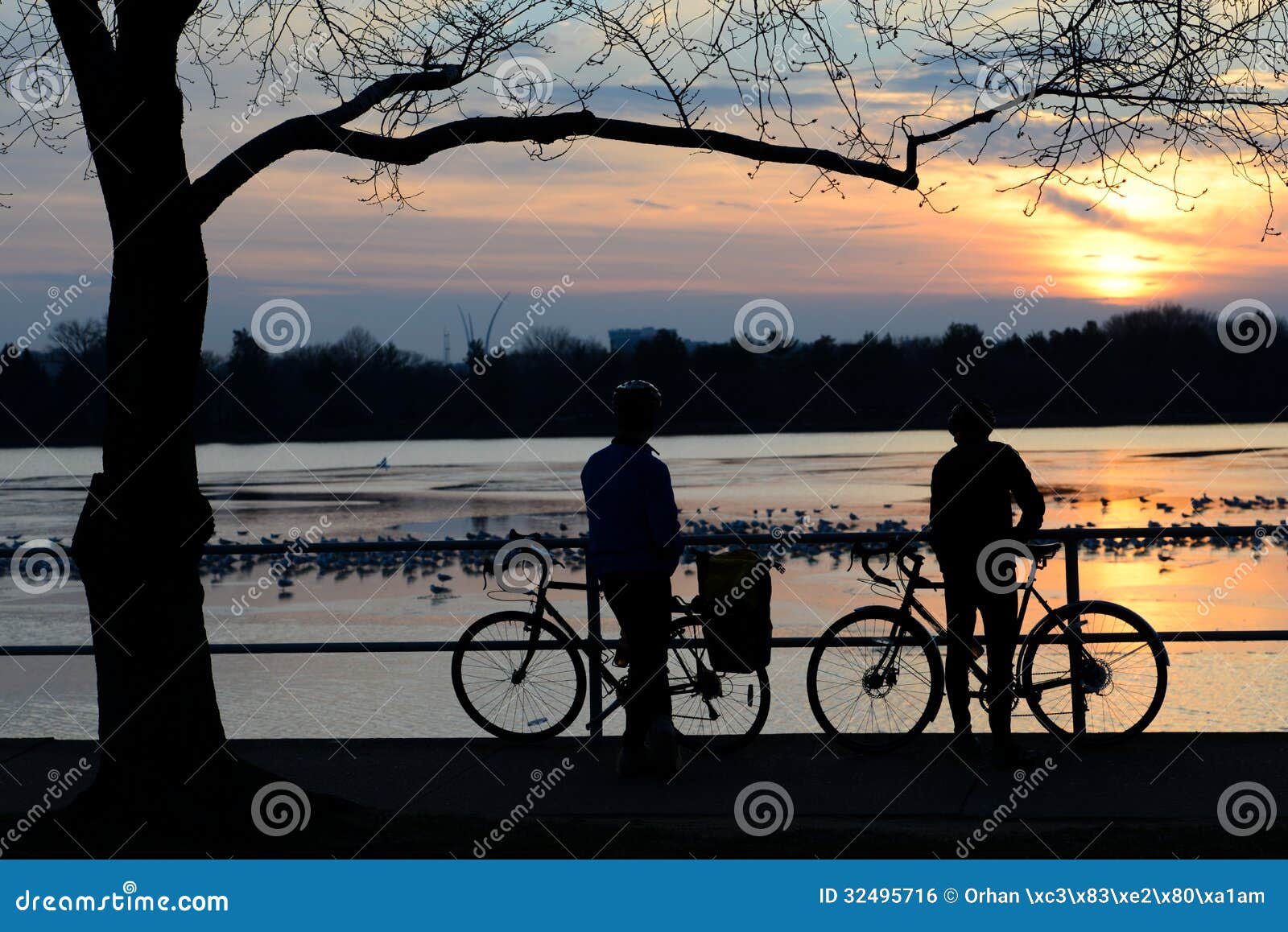 Two bikers at sunset stock photo. Image of sportsmen - 32495716