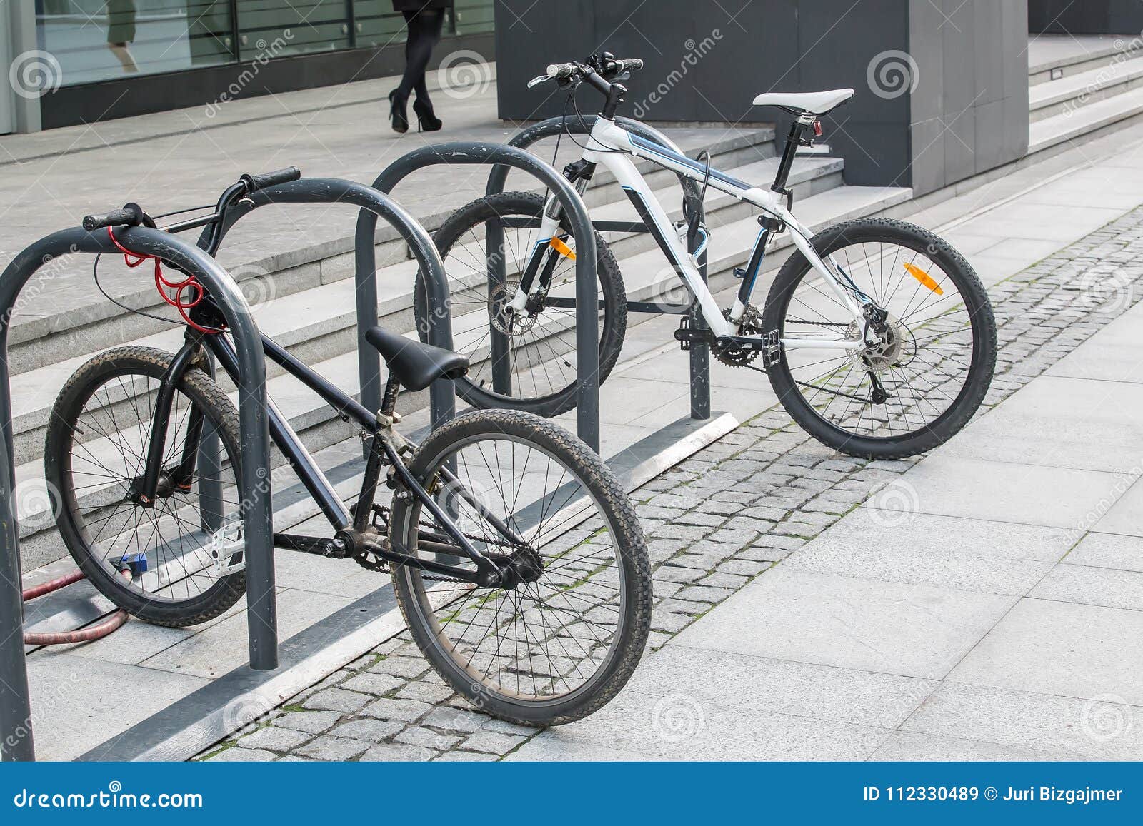 Two Bikes on the Bicycle Parking Stock Image - Image of lock, detail ...