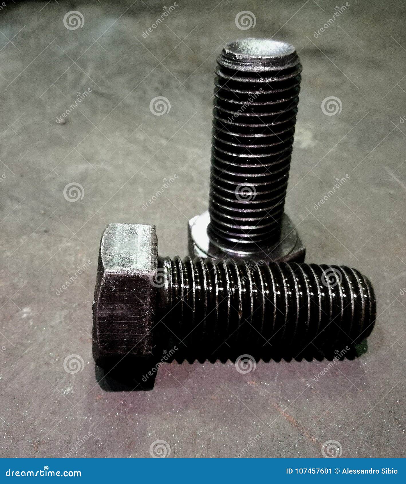 Two black screws stock image. Image of engineering, closeup - 107457601