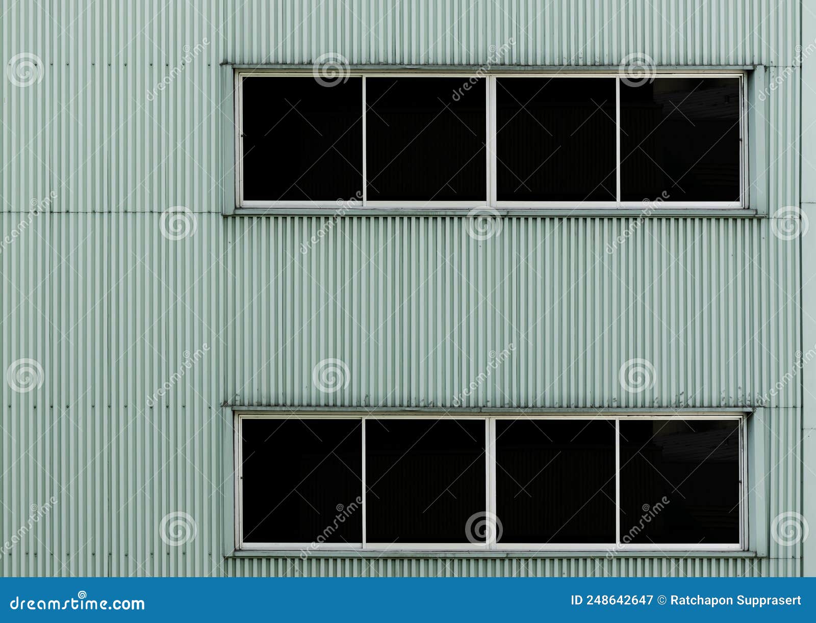 Two Black Window on Green Building Stock Image - Image of surface, line ...
