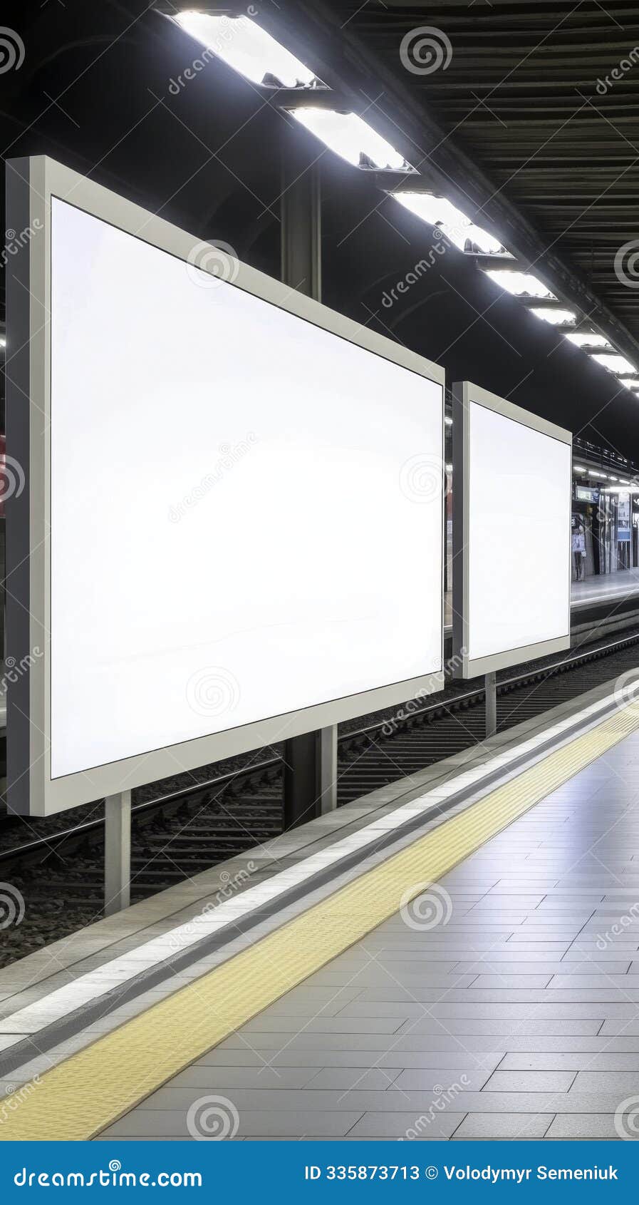 Empty Subway Tunnel with Illuminated Walls and Advertising Panels in ...