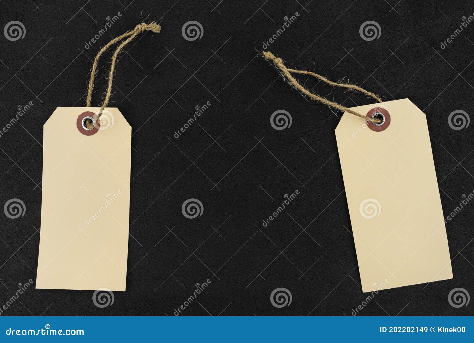 Two Blank Brown Gift Tags with a String Lying on a Black Background ...