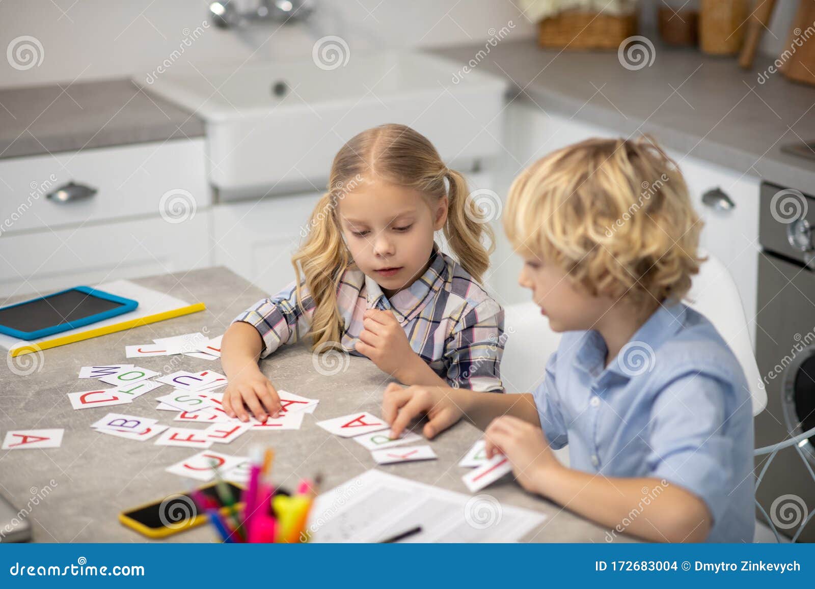 Two Blond Kids Learning Letters and Looking Interested Stock Photo ...
