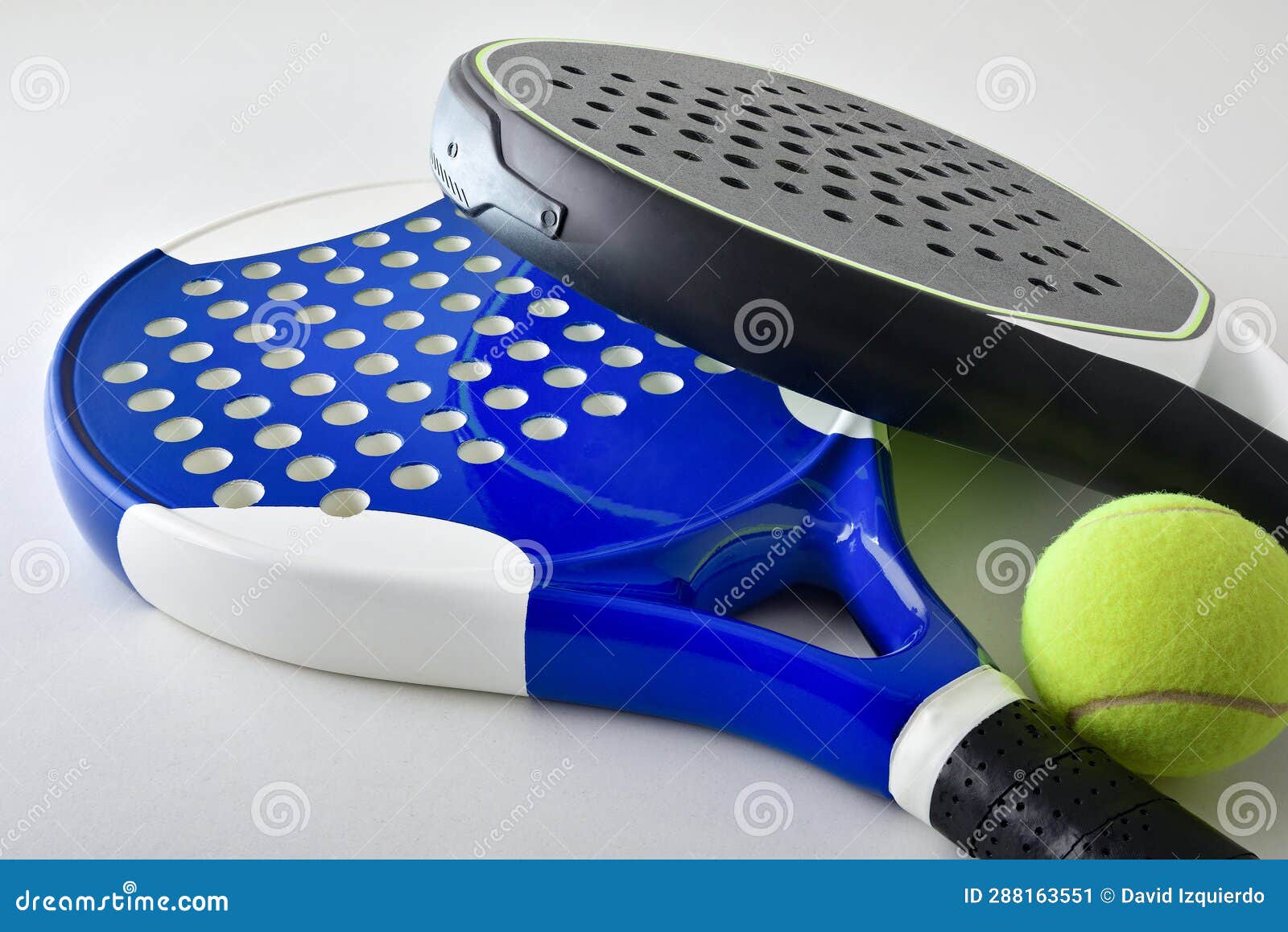 Two Blue and Black Paddle Rackets on White Table Stock Image - Image of ...