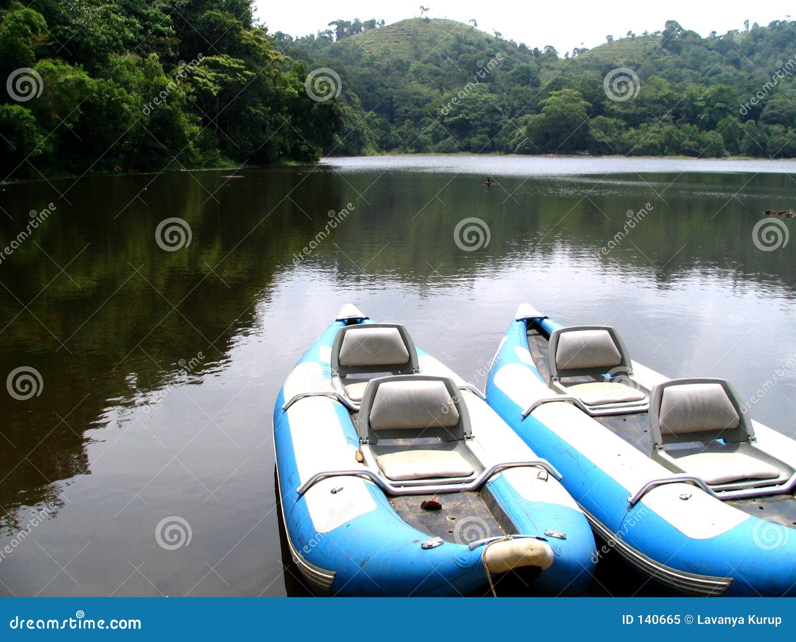 Two blue boats stock image. Image of scenery, natural, calm - 140665