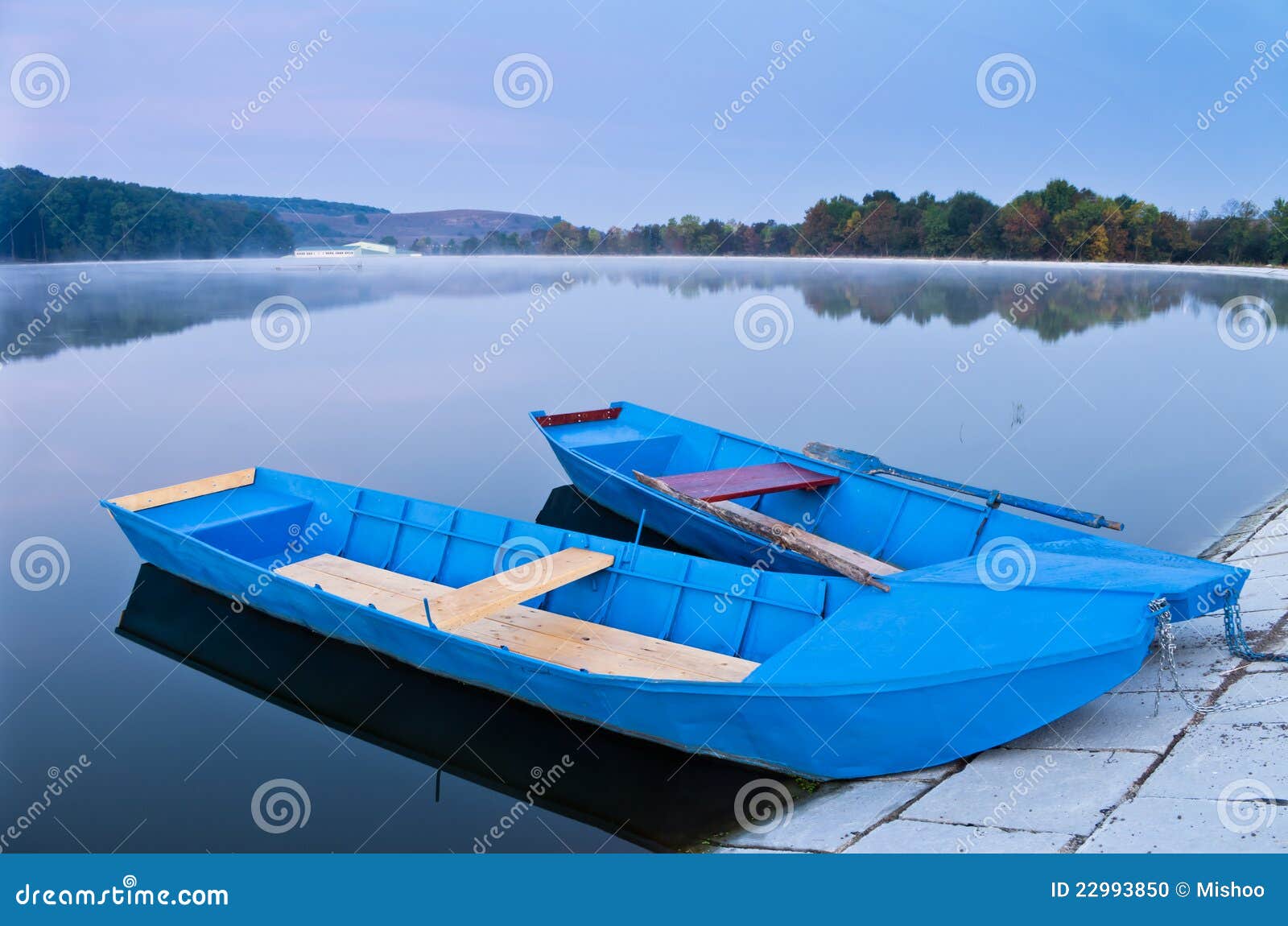 Two blue boats on lake stock photo. Image of leisure - 22993850
